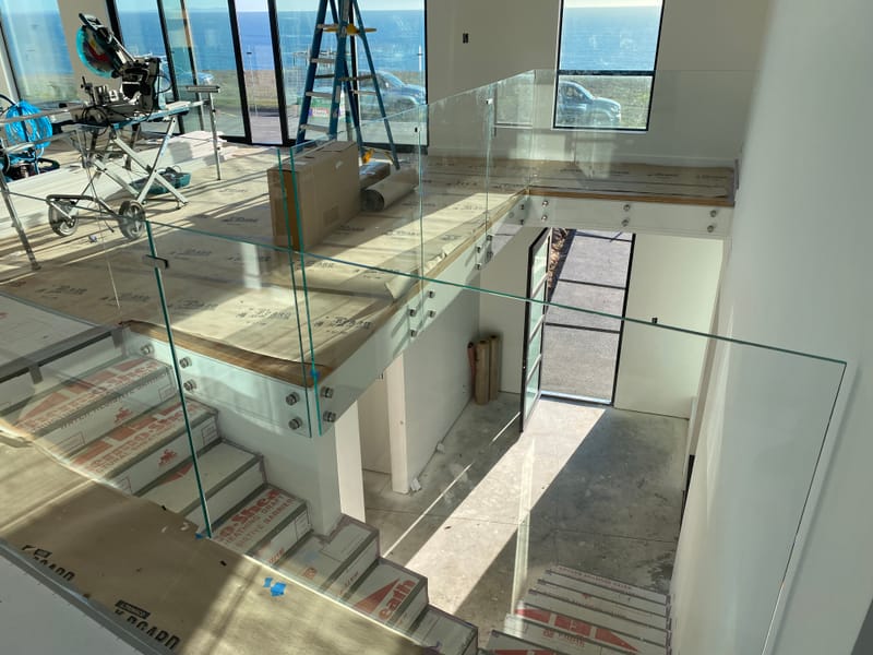 Glass railing with standoff mount. No top cap. - Integrity Glass